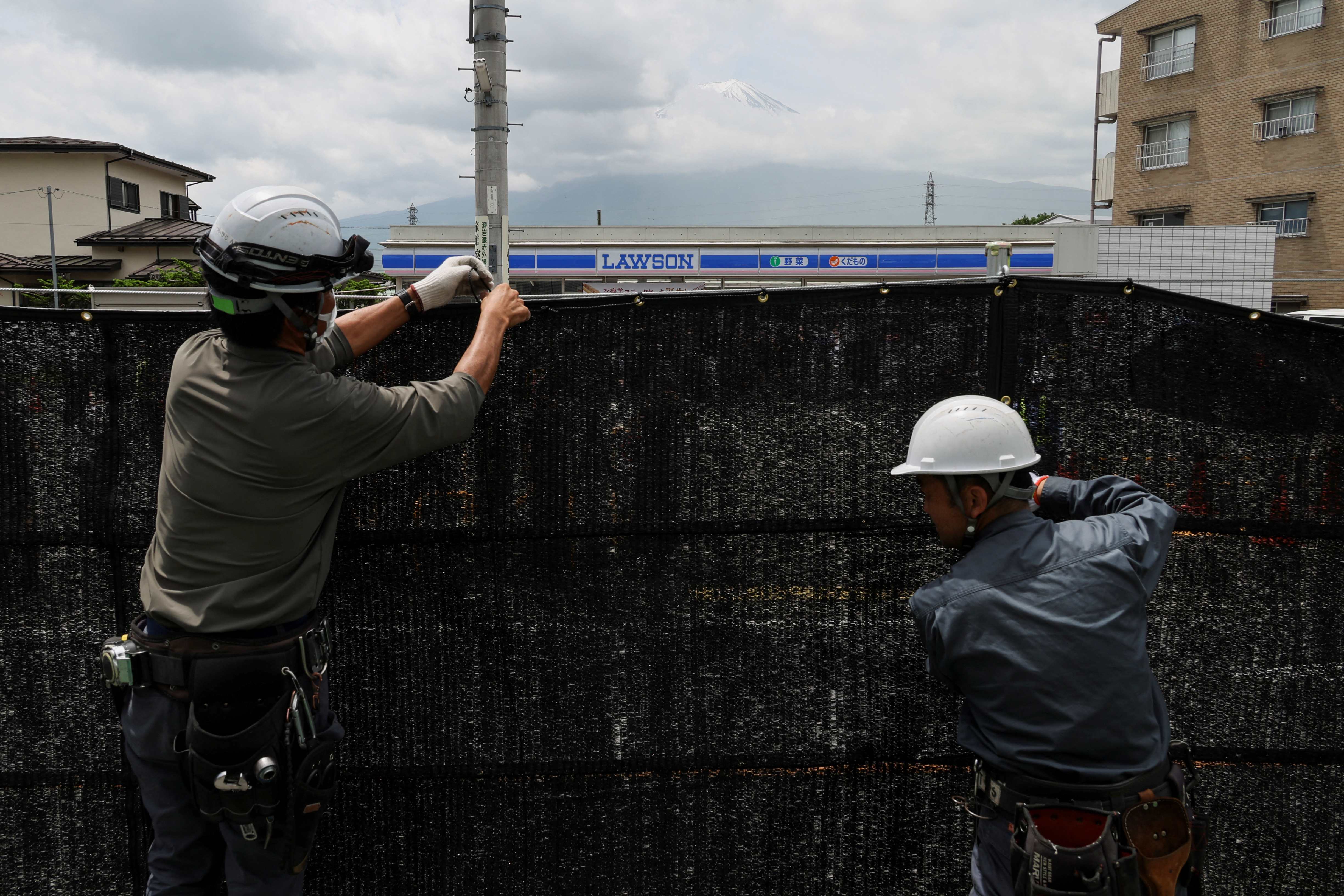 Swarmed with tourists, Japan town blocks off viral view of Mt. Fuji