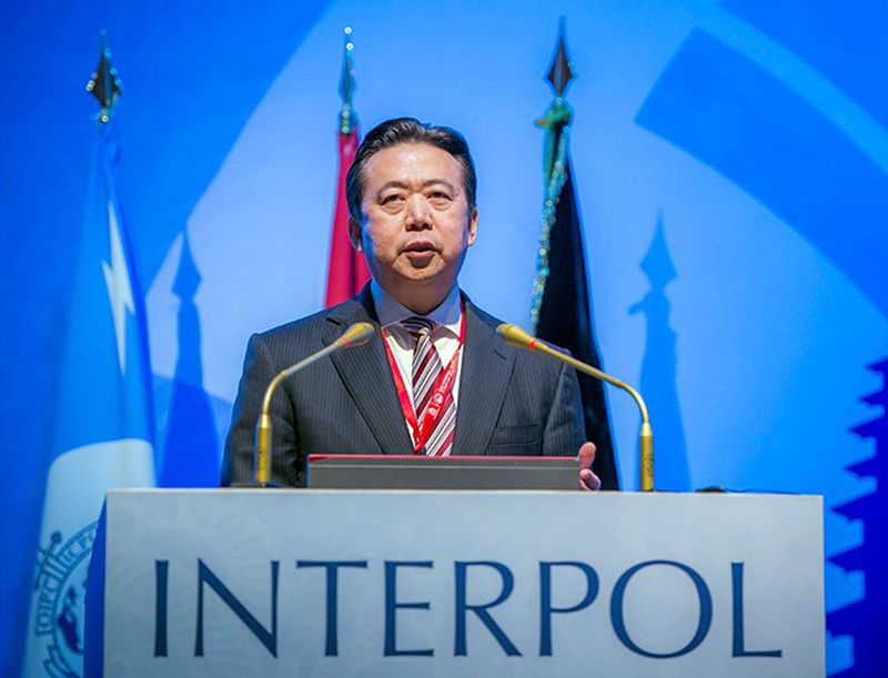 Chinese court jails former Interpol chief for 13-1/2 years over graft
