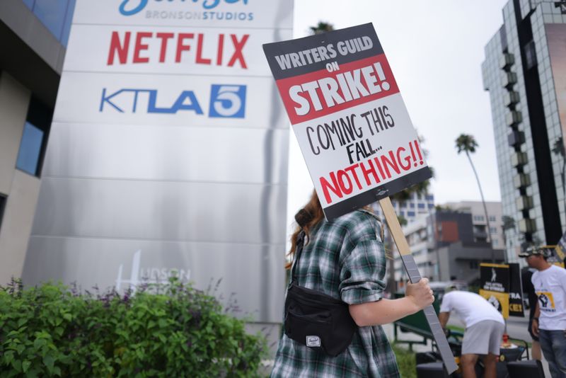 Hollywood studios offer writers a new deal with push from Netflix, Iger ...
