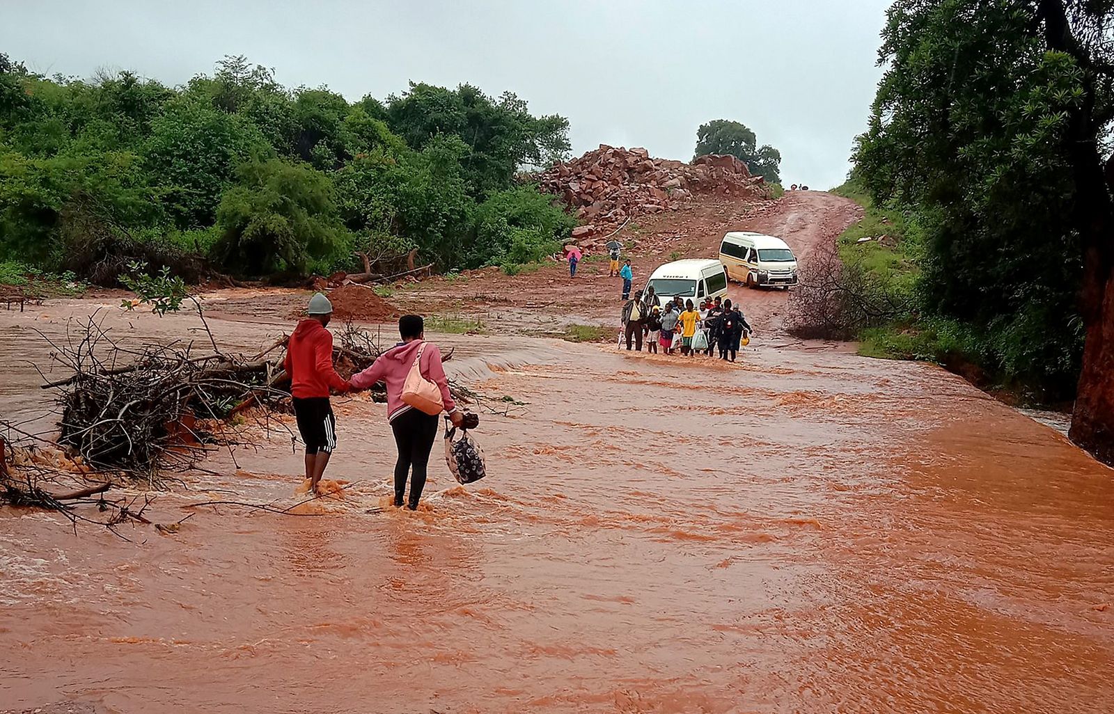 Relief in the skies, ruin on the ground as deadly floods kill 37 and ...